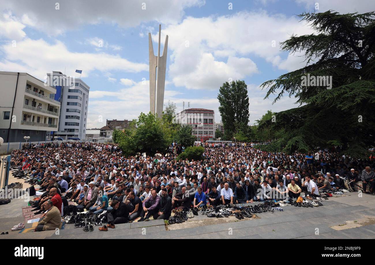 Hundreds of Kosovo Muslim faithful pray in the main square of the ...