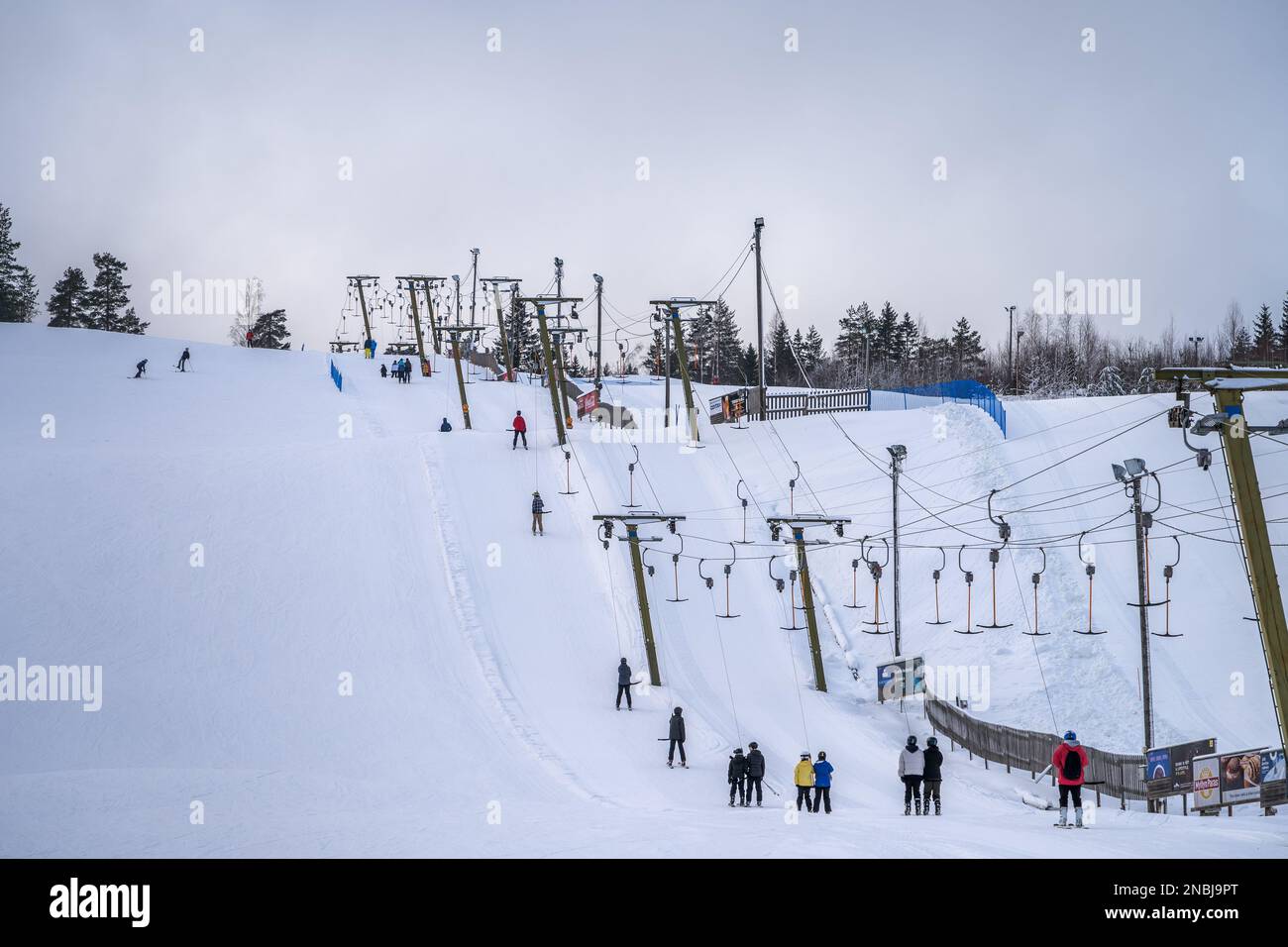 People on ski lifts at the Messilä Ski Resort in Hollola, Finland. February 7, 2023 Stock Photo ...