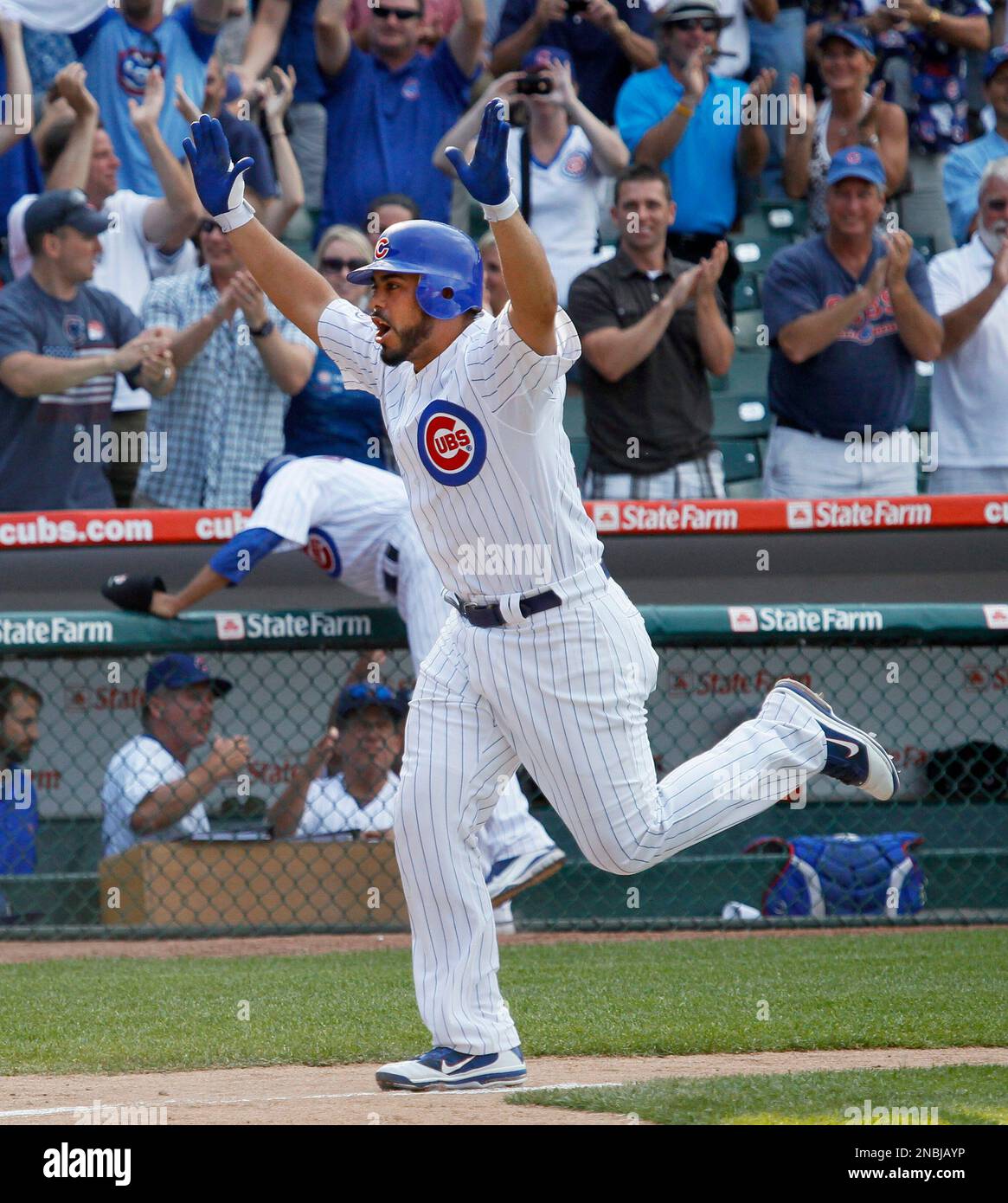 Chicago Cubs pinch-hitter Geovany Soto heads home, celebrating his ...