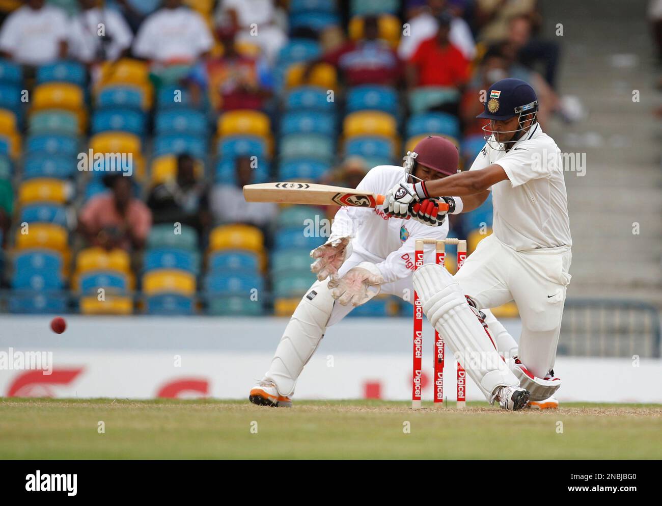 India's Suresh Raina, right, bats as West Indies' wicket keeper Carlton ...