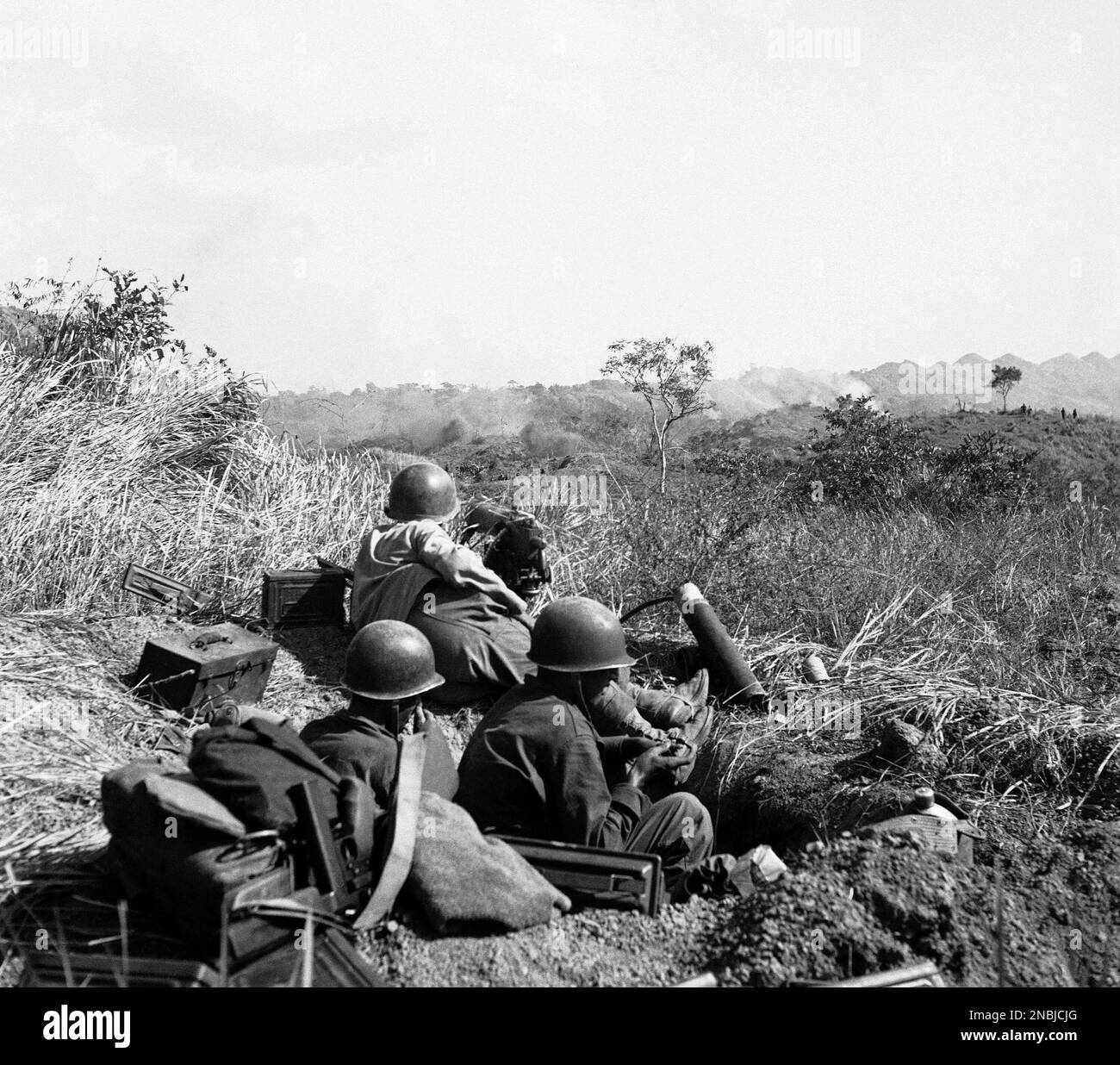 An American 30 calibre machine gun fires across the Manila North ...