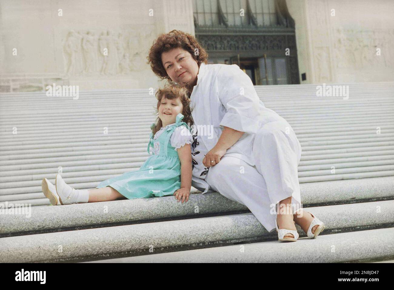 Barbara Dixon shown with her daughter Emily, 3, on the steps of the ...