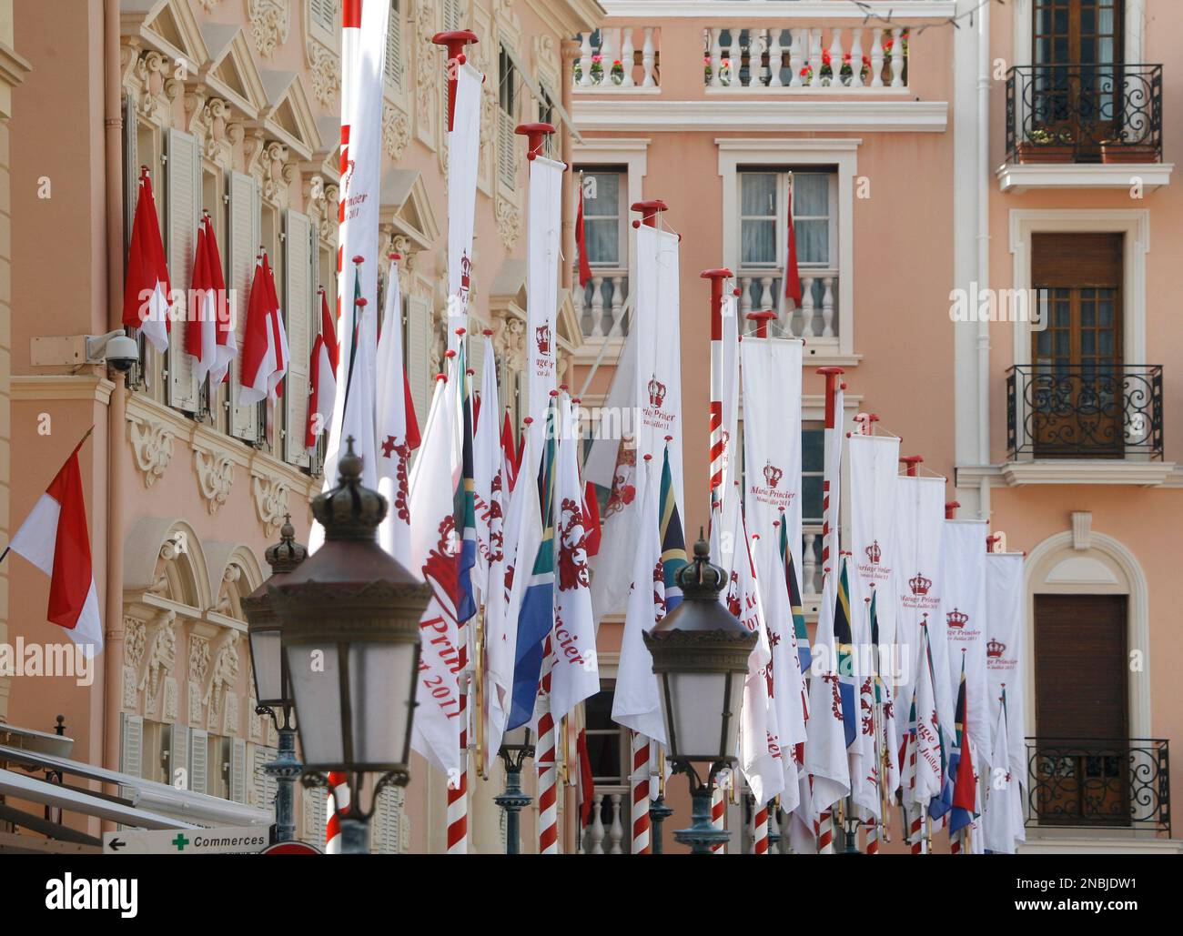 Flags hang outside the Monaco Palace in Monaco, Thursday, June 30, 2011 ...