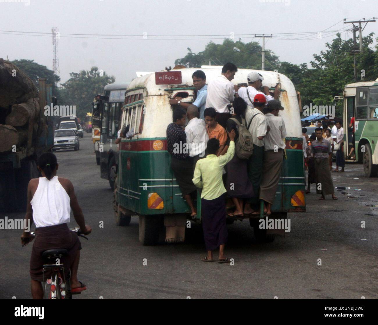 Passengers pack a World War II-era bus during a rush hour in south ...