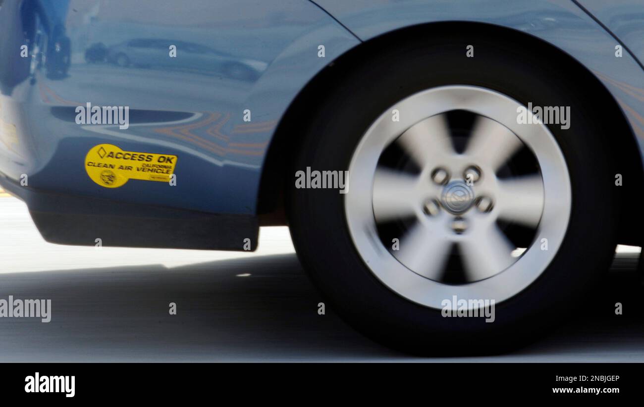 In a June 28, 2011 photo, Toyota Prius hybrid autos bearing California ...