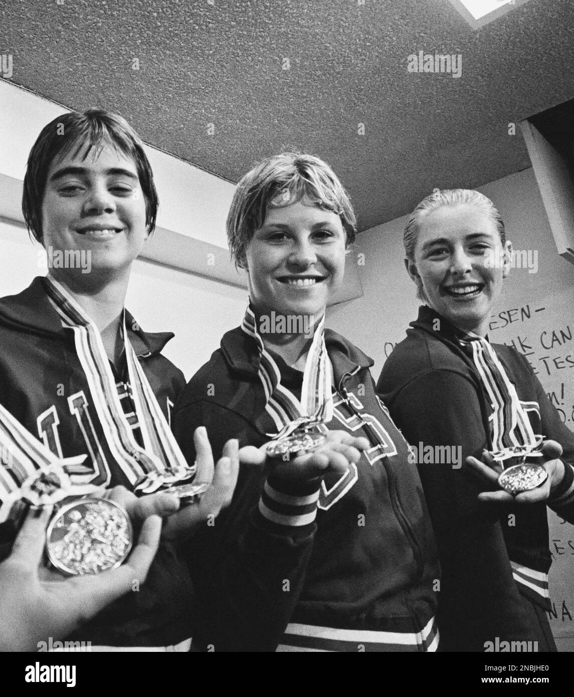 Four young women display gold medals they won in the Olympics 400-meter ...
