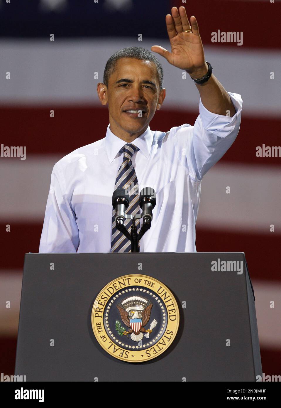 President Barack Obama waves before speaking to workers at the Alcoa ...