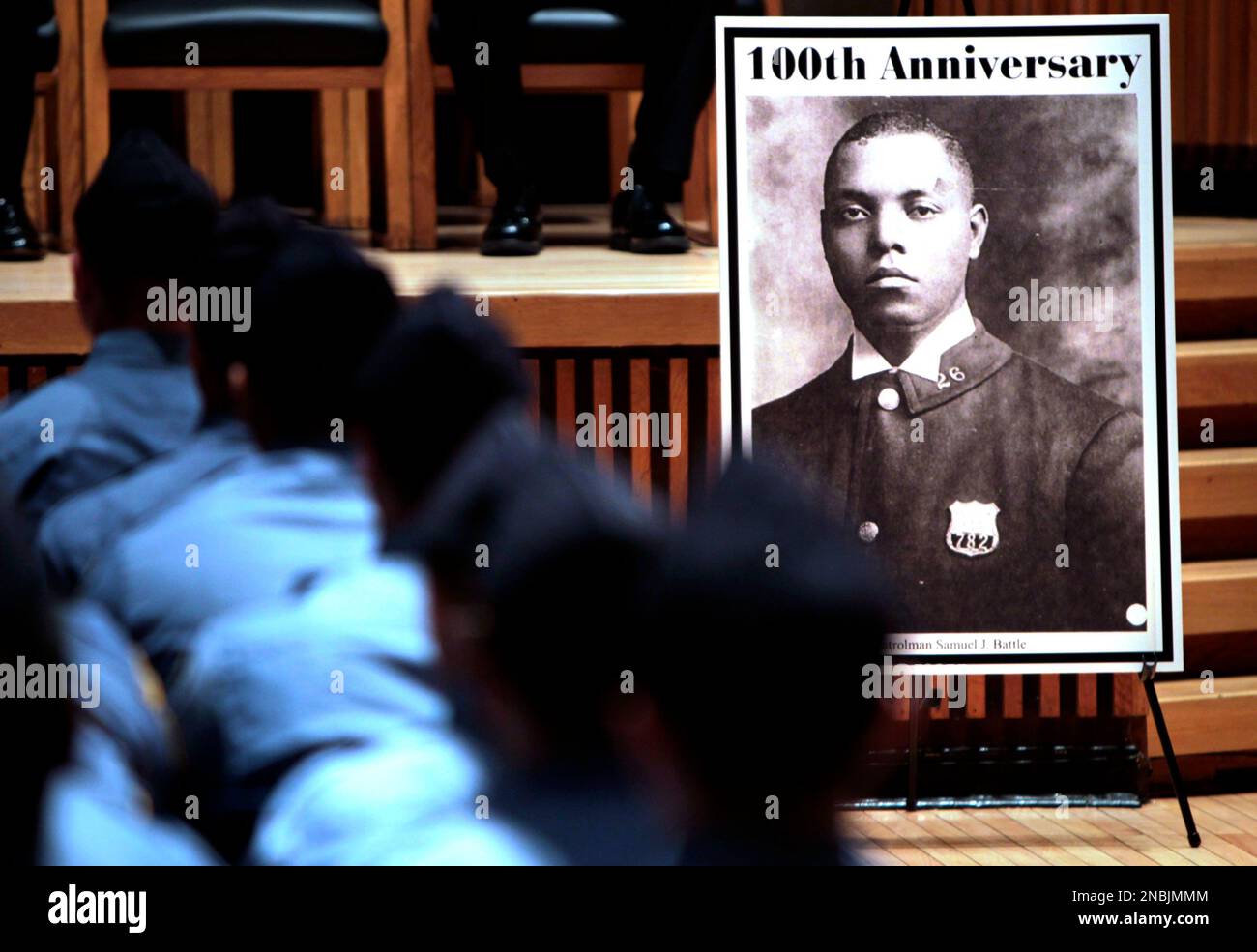 A picture of Samuel Battle is displayed during a graduation ceremony ...