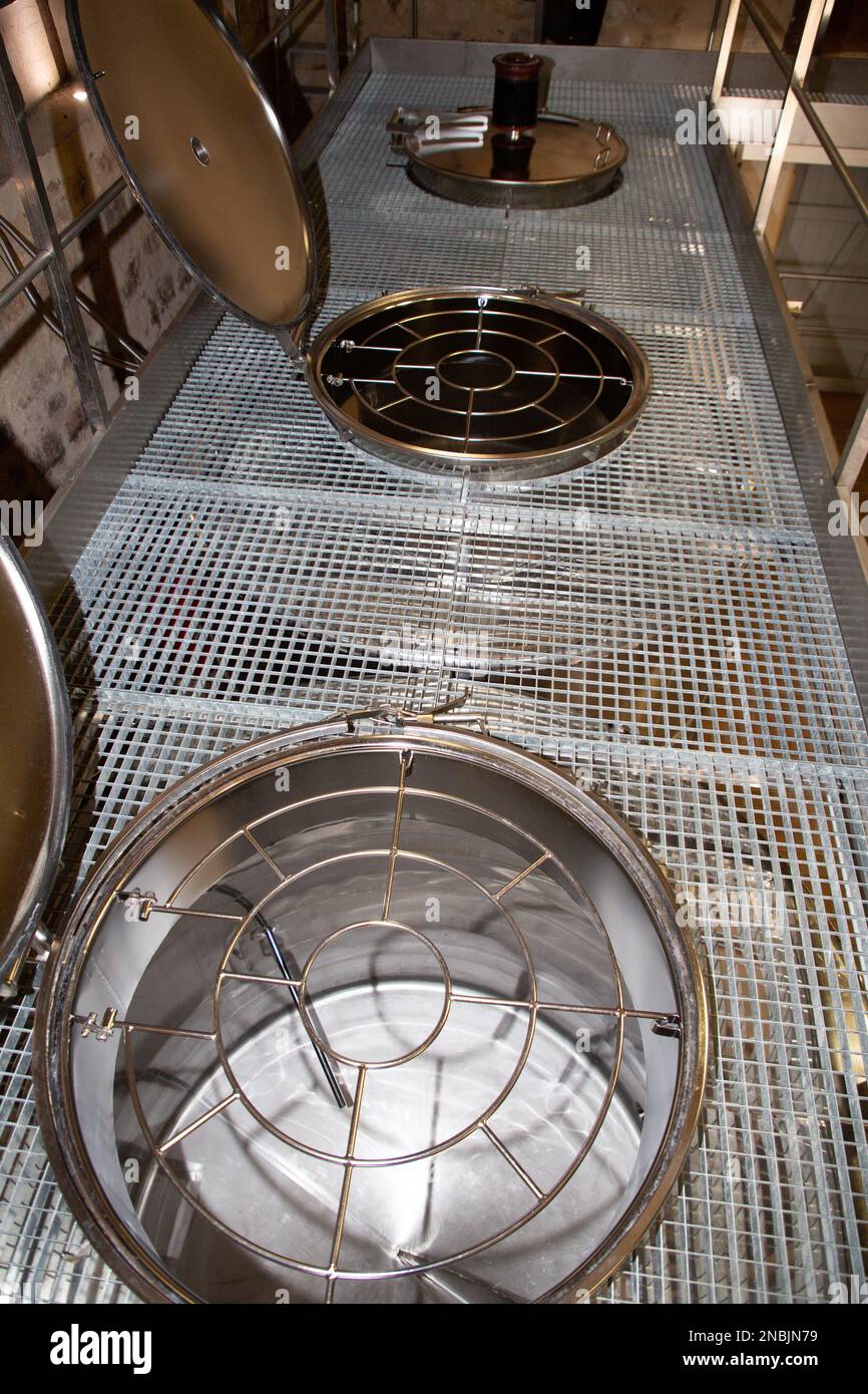 Aluminum containers for maturing wine in a winery Stock Photo - Alamy