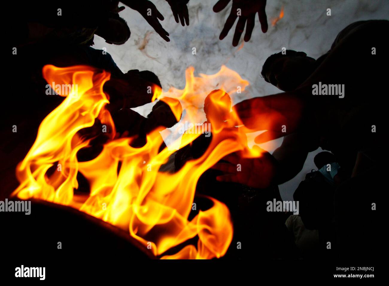 Nepalese Hindu devotees offer prayers after lighting butter lamps ...