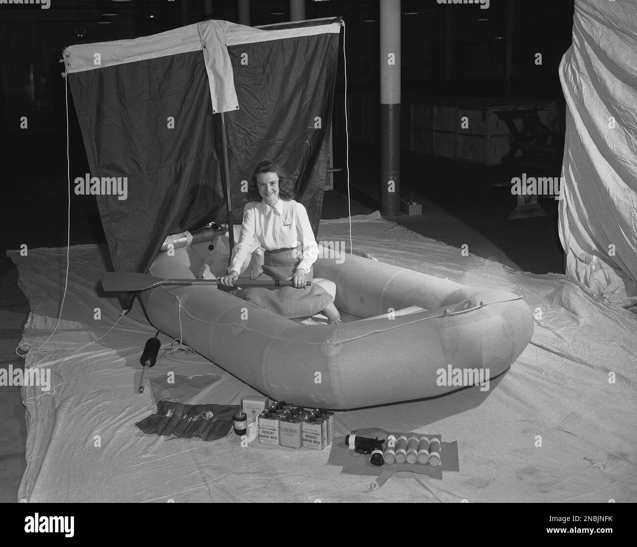 Mary Doig demonstrates how the latest type life raft is handled in New ...