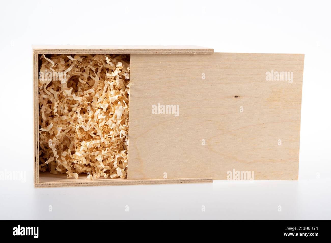 Wooden square boxes with closed sliding lid on white grey background ...