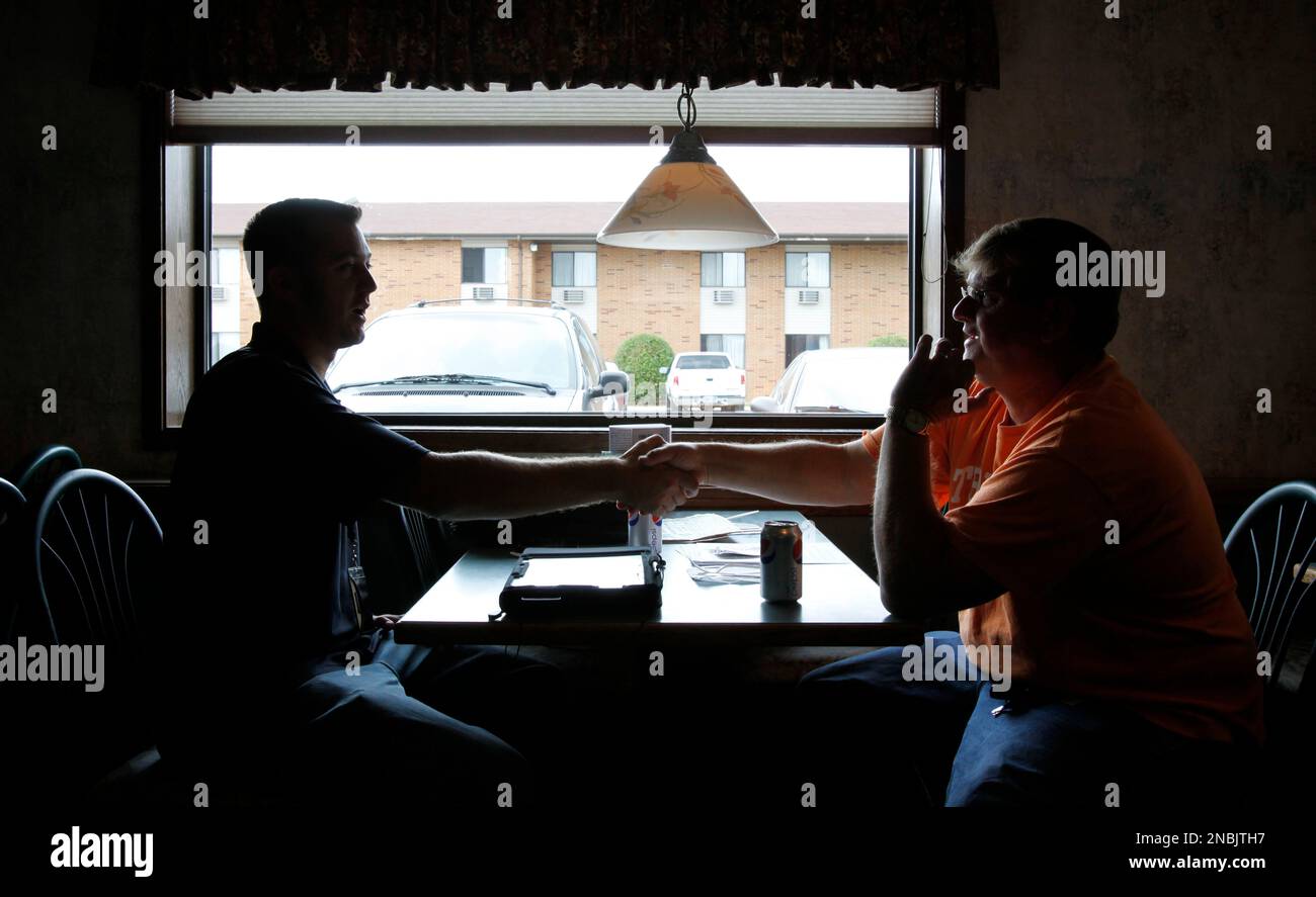 FEMA housing inspector Travis Rule, left, from Fort Myers, Fla., shakes ...