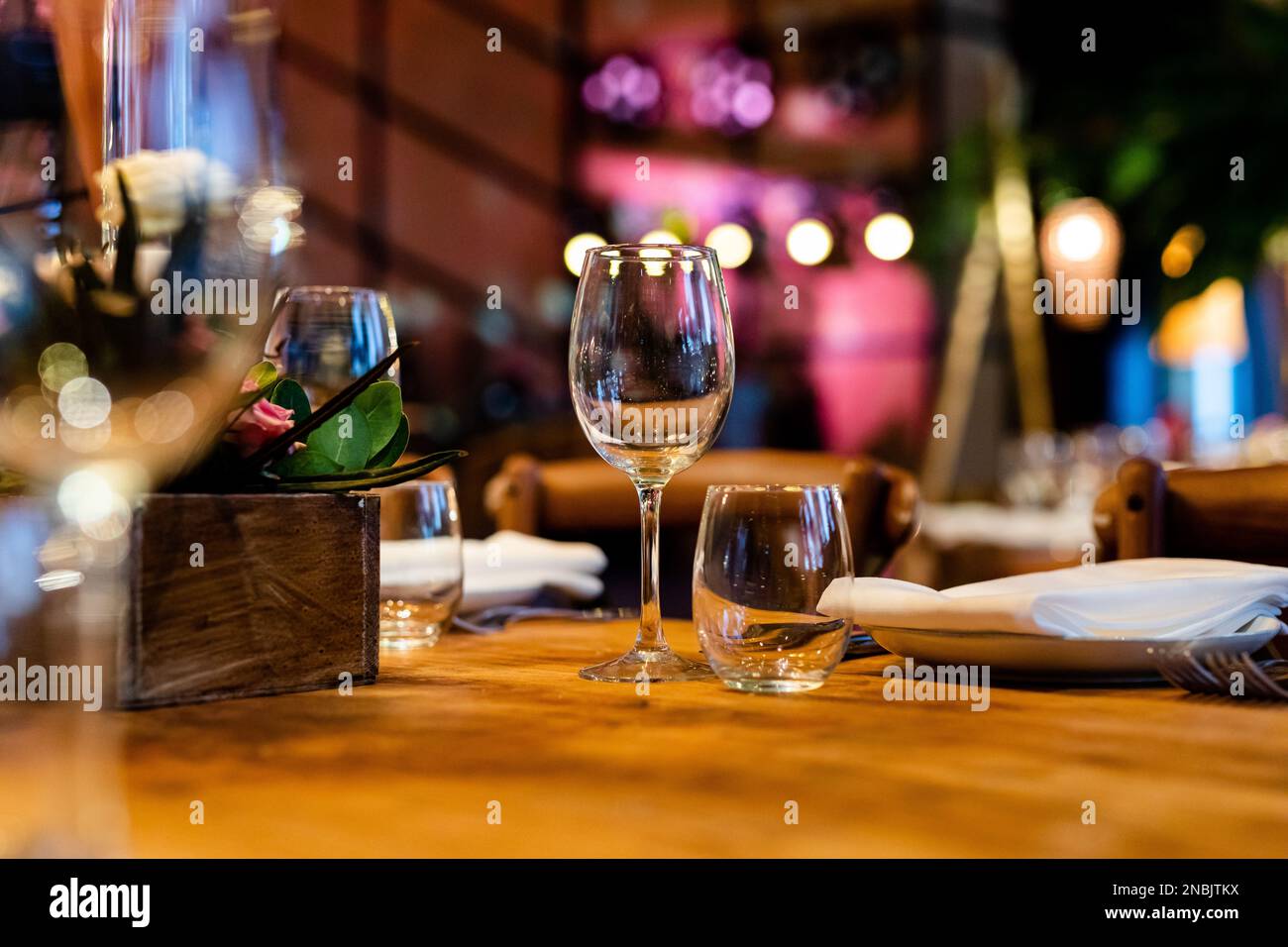 Luxury table settings for fine dining with and glassware, pouring wine ...