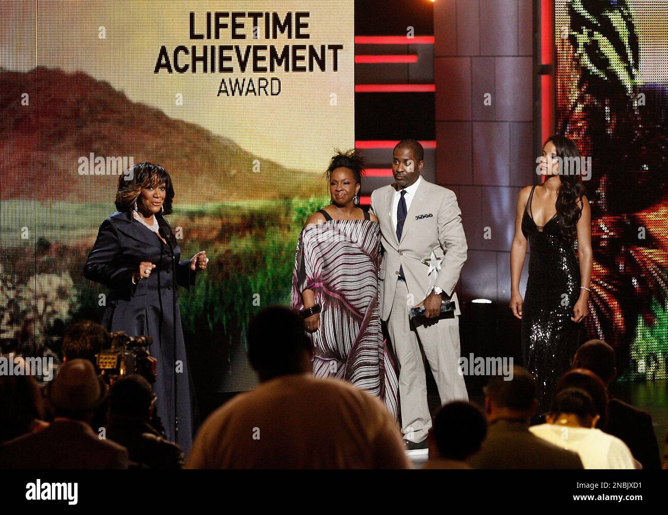 Patti LaBelle, left, accepts the lifetime achievement award, as Gladys ...