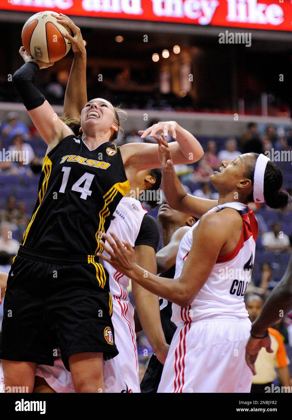 Tulsa Shock Kayla Pedersen (14) goes to the basket against Washington ...