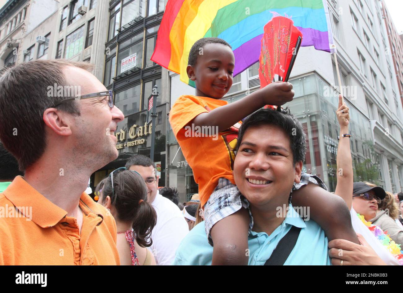 Christopher Goeken, left, his partner Glenn Magpantay, right, and their ...