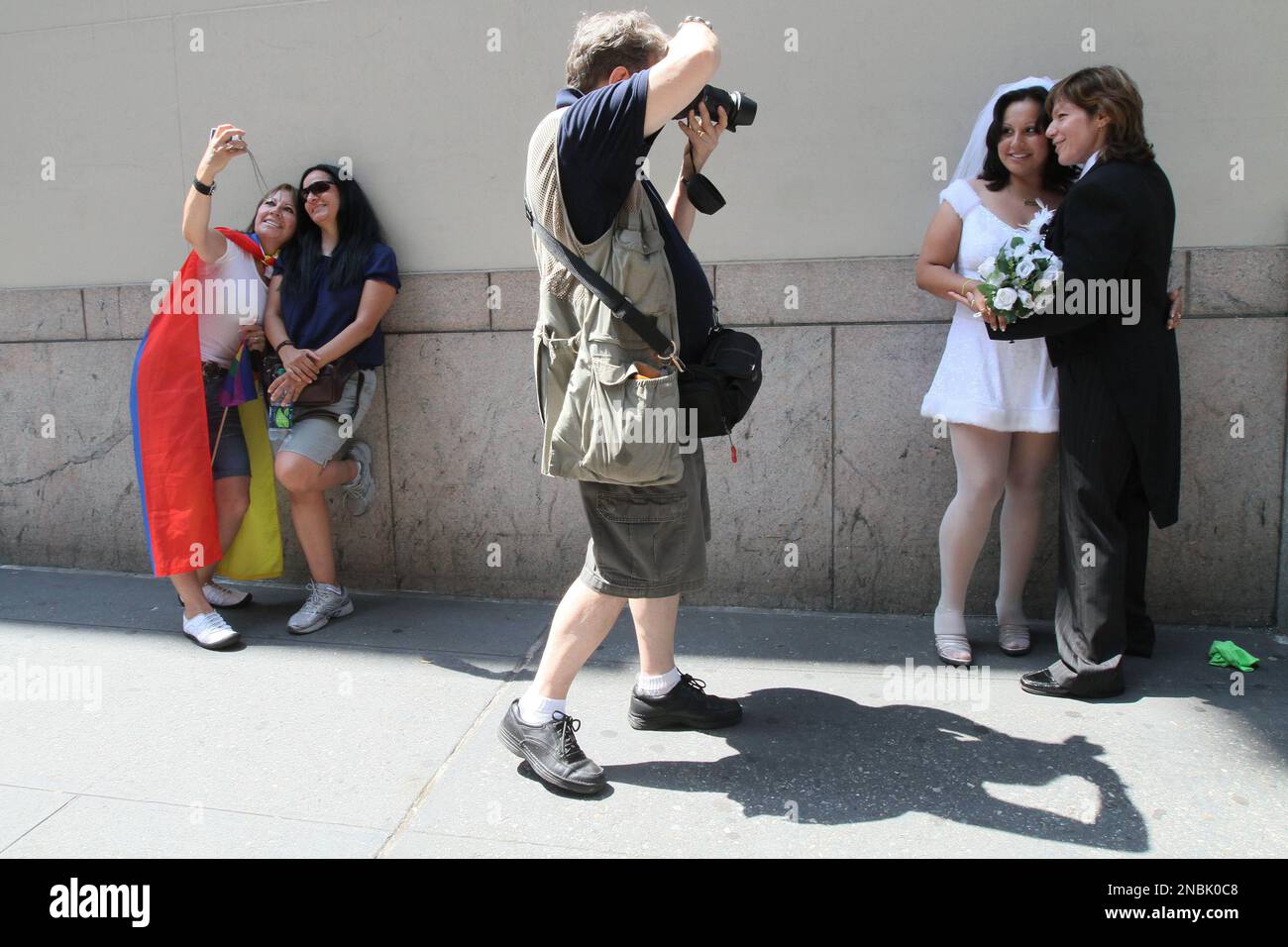 Dressed as a groom, Linda Collazo, right, and her partner Paola Perez ...