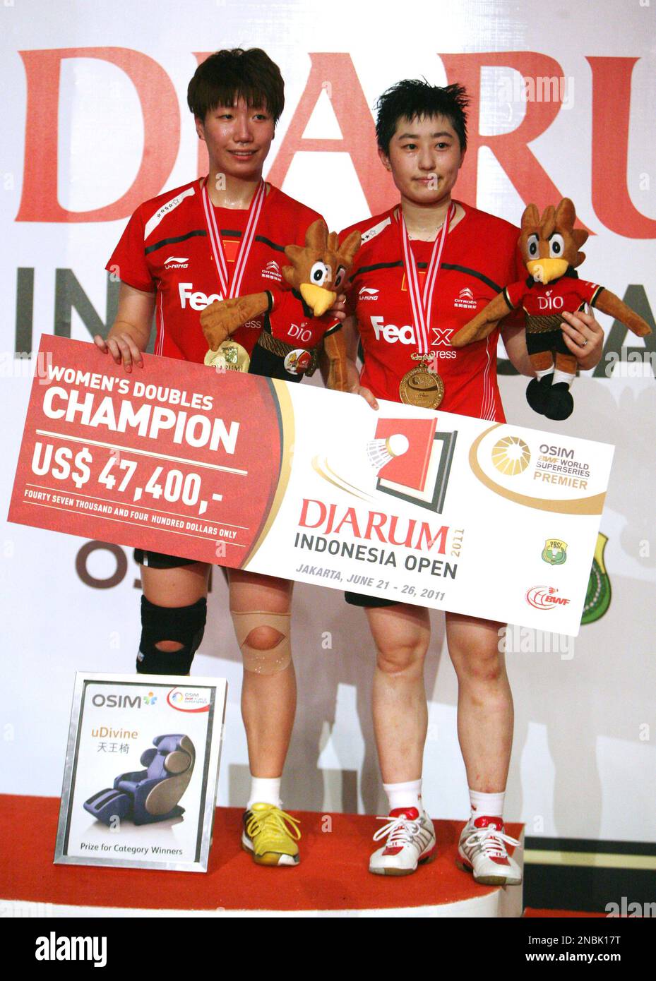 China's Wang Xiaoli, left, and her teammate Yu Fang celebrate after defeating Indonesia's Vita ...