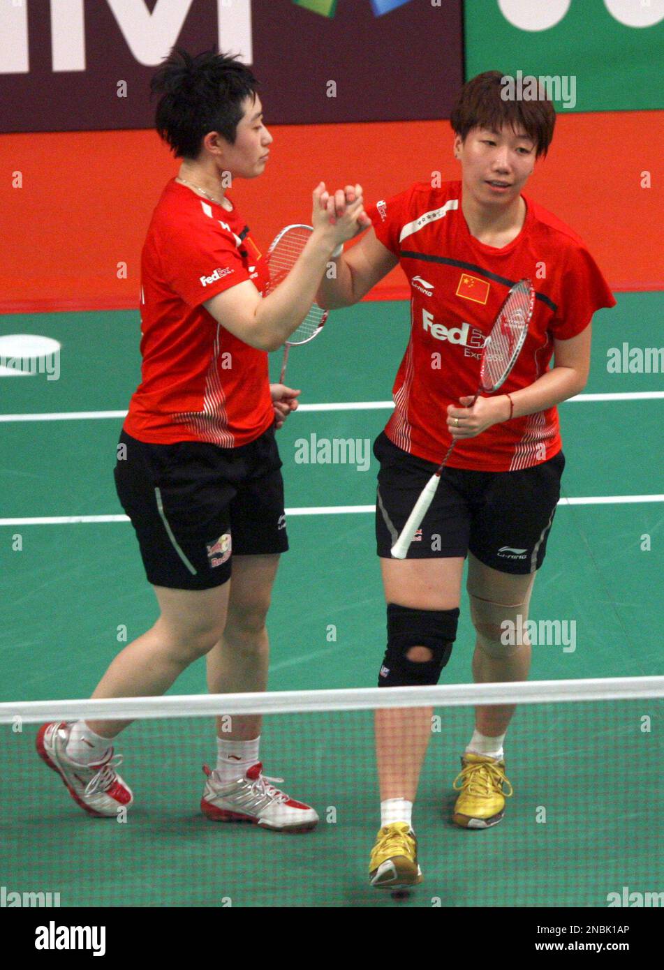 China's Wang Xiaoli, right, and her teammate Yu Fang celebrate after ...
