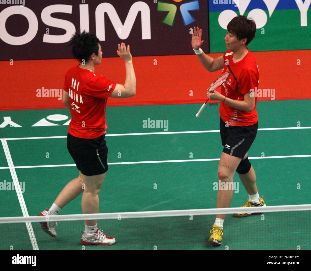 China's Wang Xiaoli, right, and her teammate Yu Fang celebrate after ...