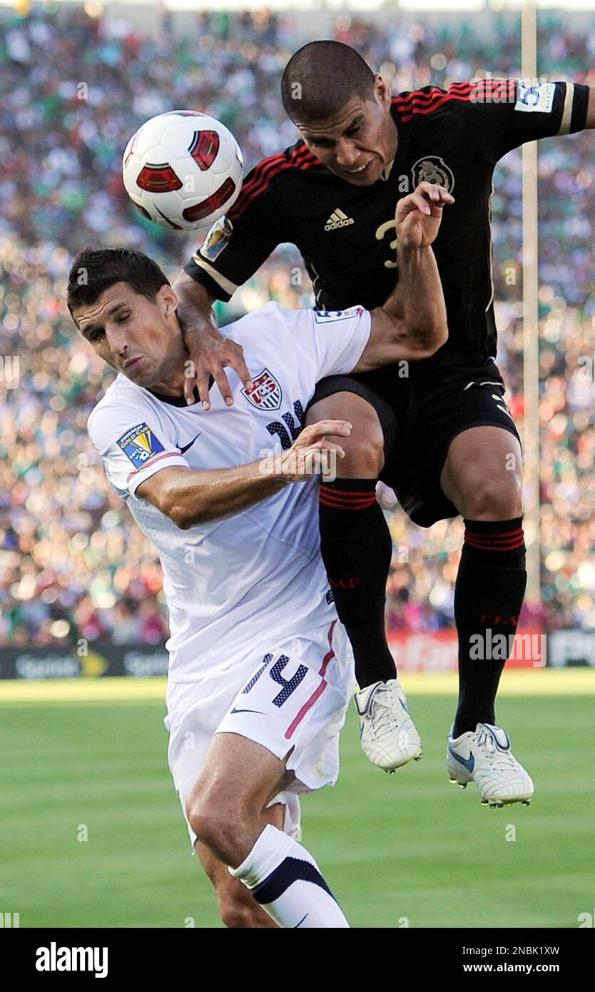 United States' Eric Lichaj, left, and Mexico's Carlos Salcido vie for ...