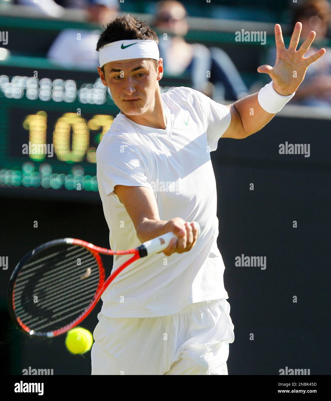 Australia's Bernard Tomic returns a forehand shot to Sweden's Robin ...
