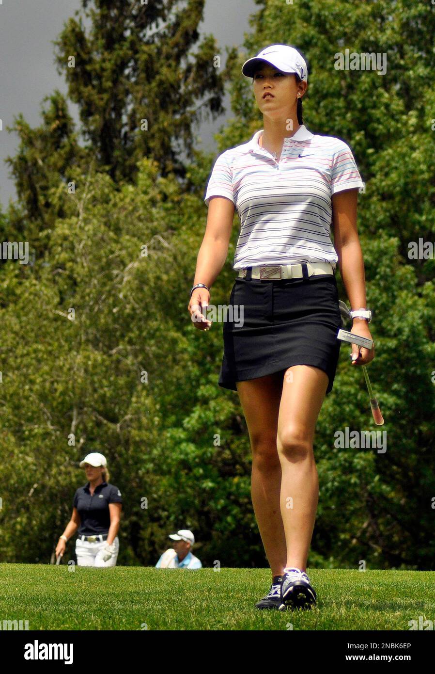 Michelle Wie walks along the 11th green during the second round of the ...