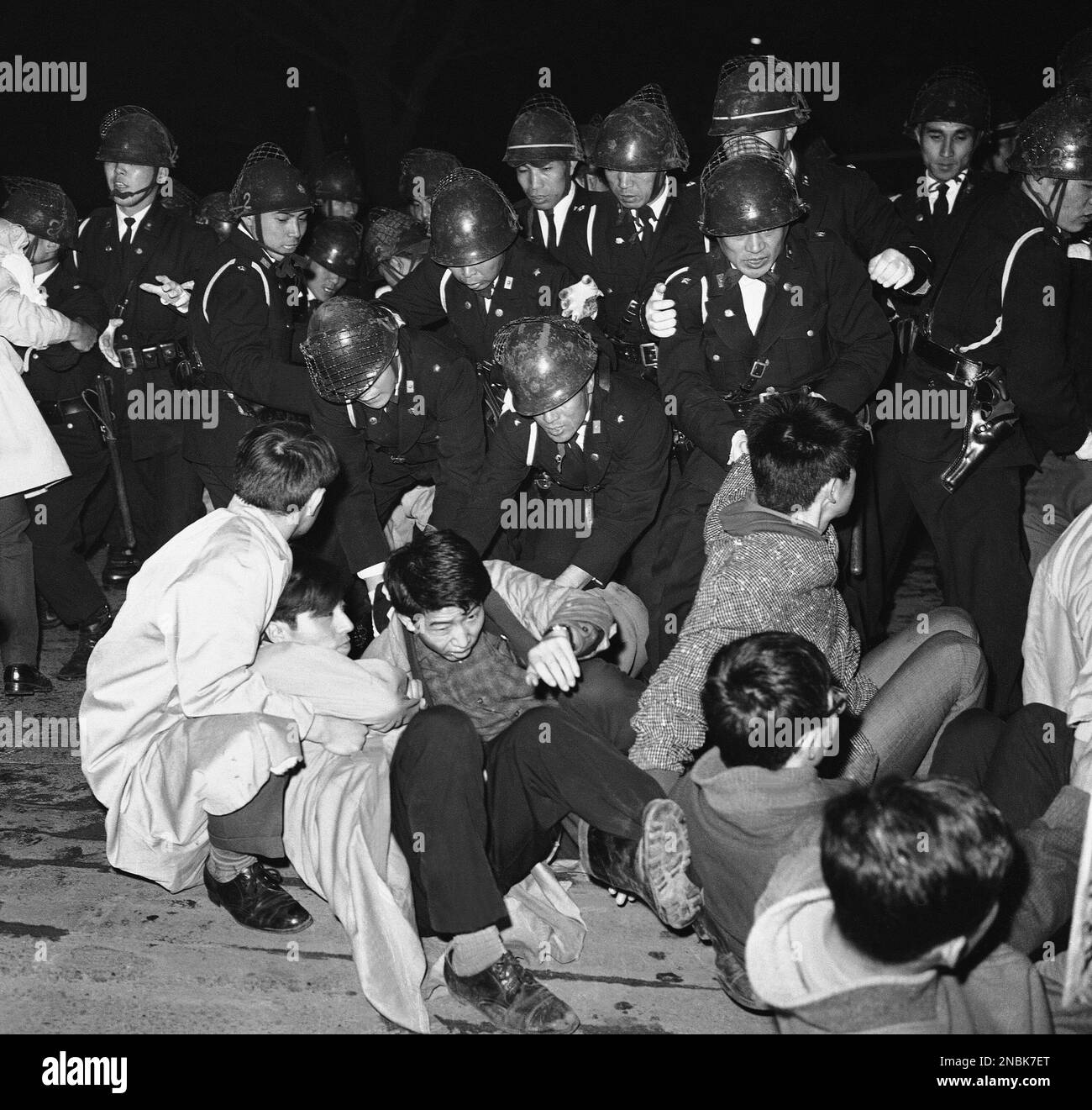 Helmeted Japanese riot police break up demonstration by pro-Communist ...