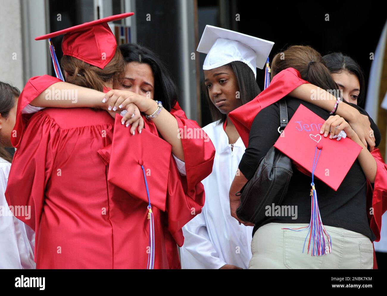 Classmates of Jennifer Mejia console each other outside of Our Lady of ...