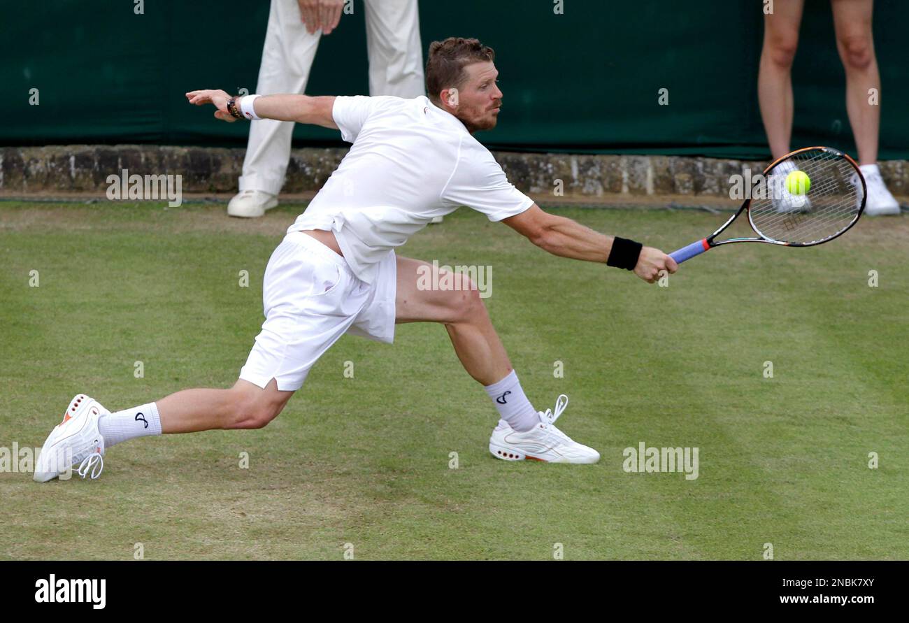 Alex Bogomolov Jr. of the US returns a shot to Tomas Berdych of the ...