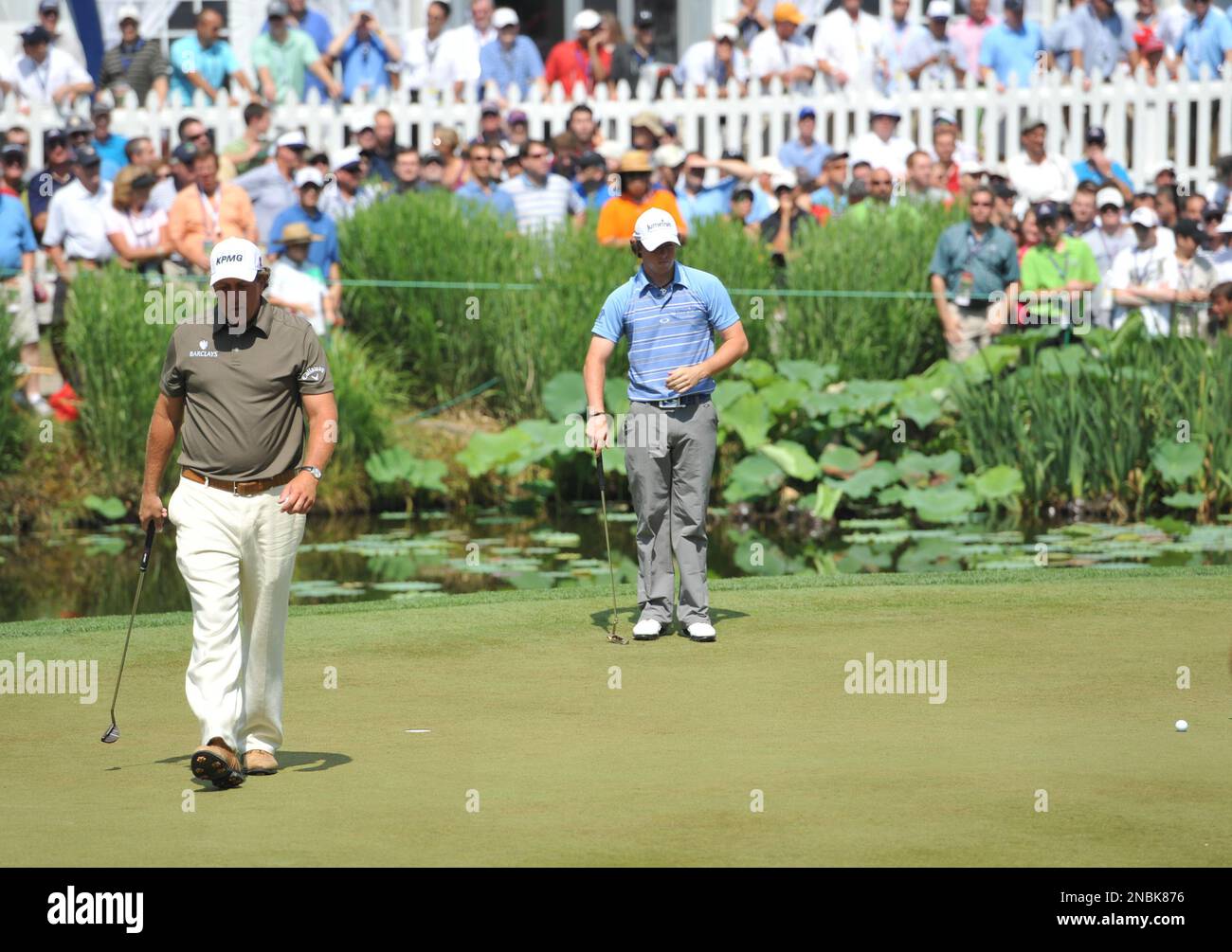 Rory McIlroy, right, and Phil Mickelson on the green during the U.S ...