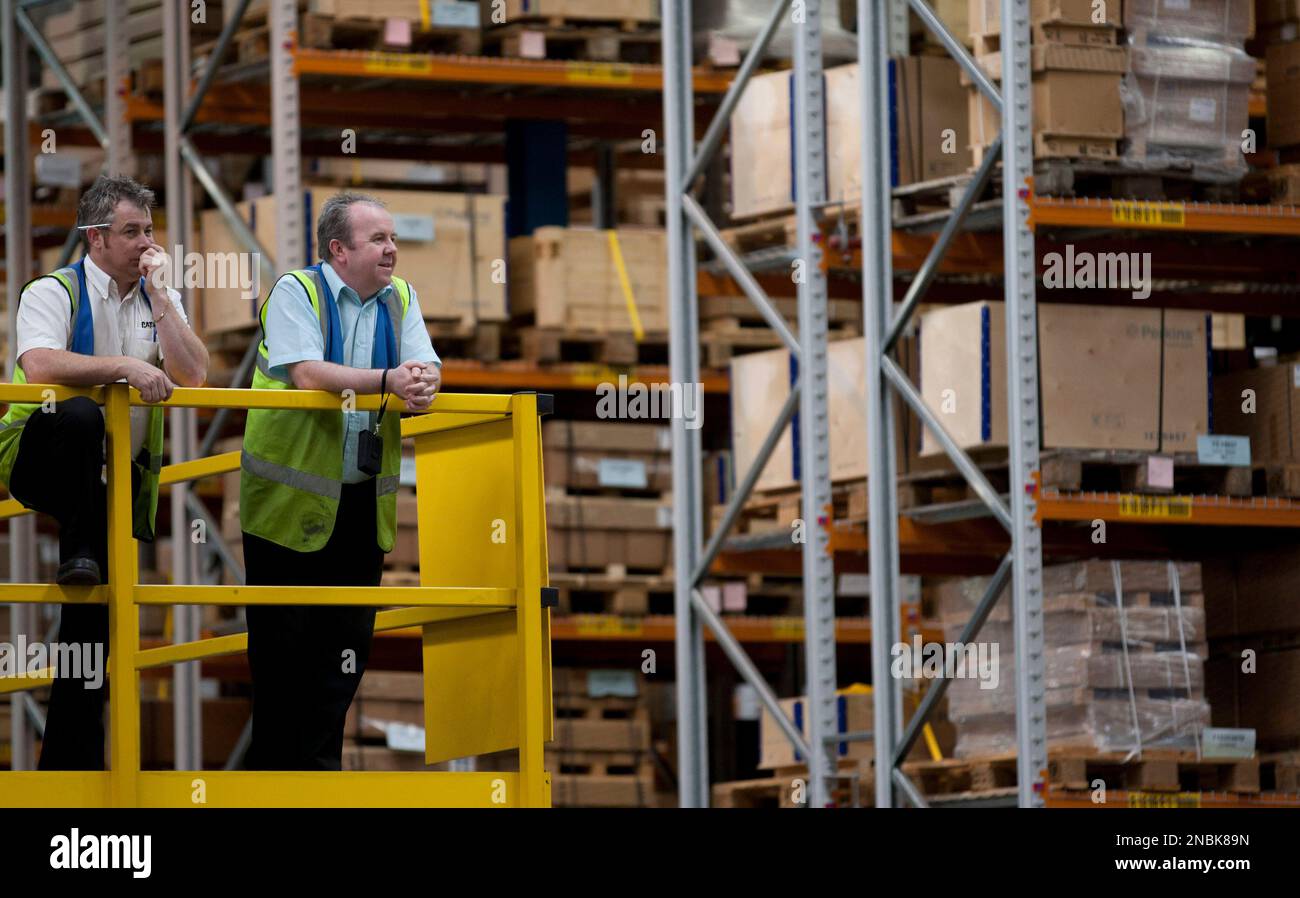Members of staff watch the British Broadcasting Corporation's ...