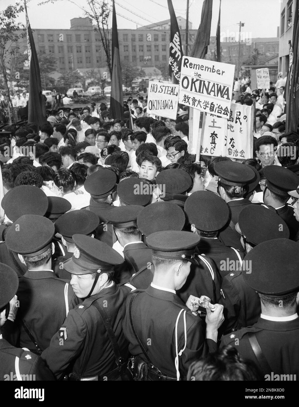 Police push students back from the U.S. Embassy’s main gate in Tokyo ...