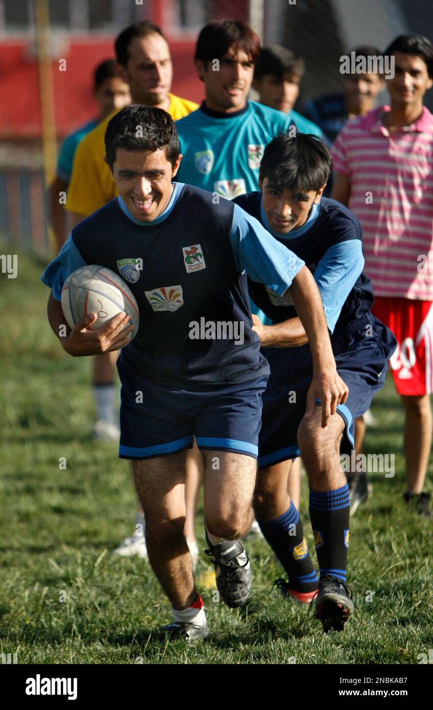 In this June 18, 2011 photo, Afghan rugby players work out in a field ...