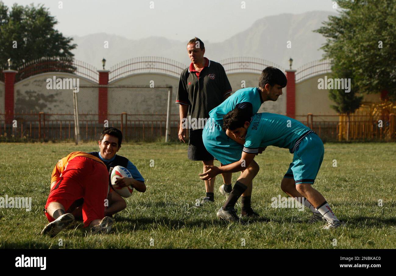 In this June 18, 2011 photo, Afghan rugby players practice as Steve ...