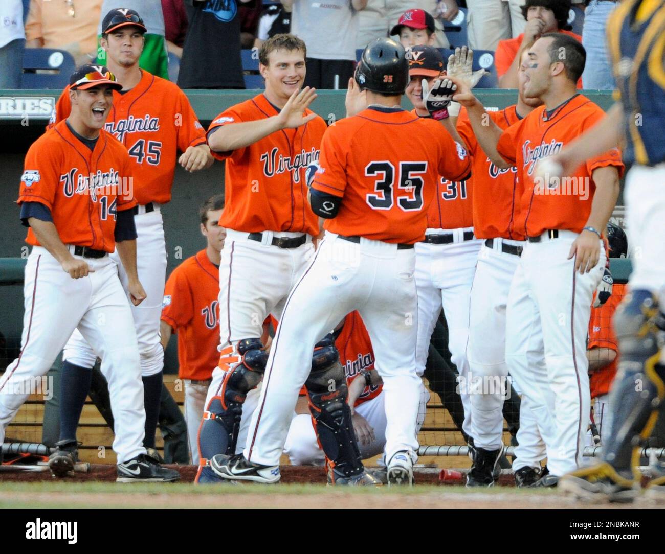 Virginia's Kenny Swab (35) celebrates with teammates Colin Harrington ...