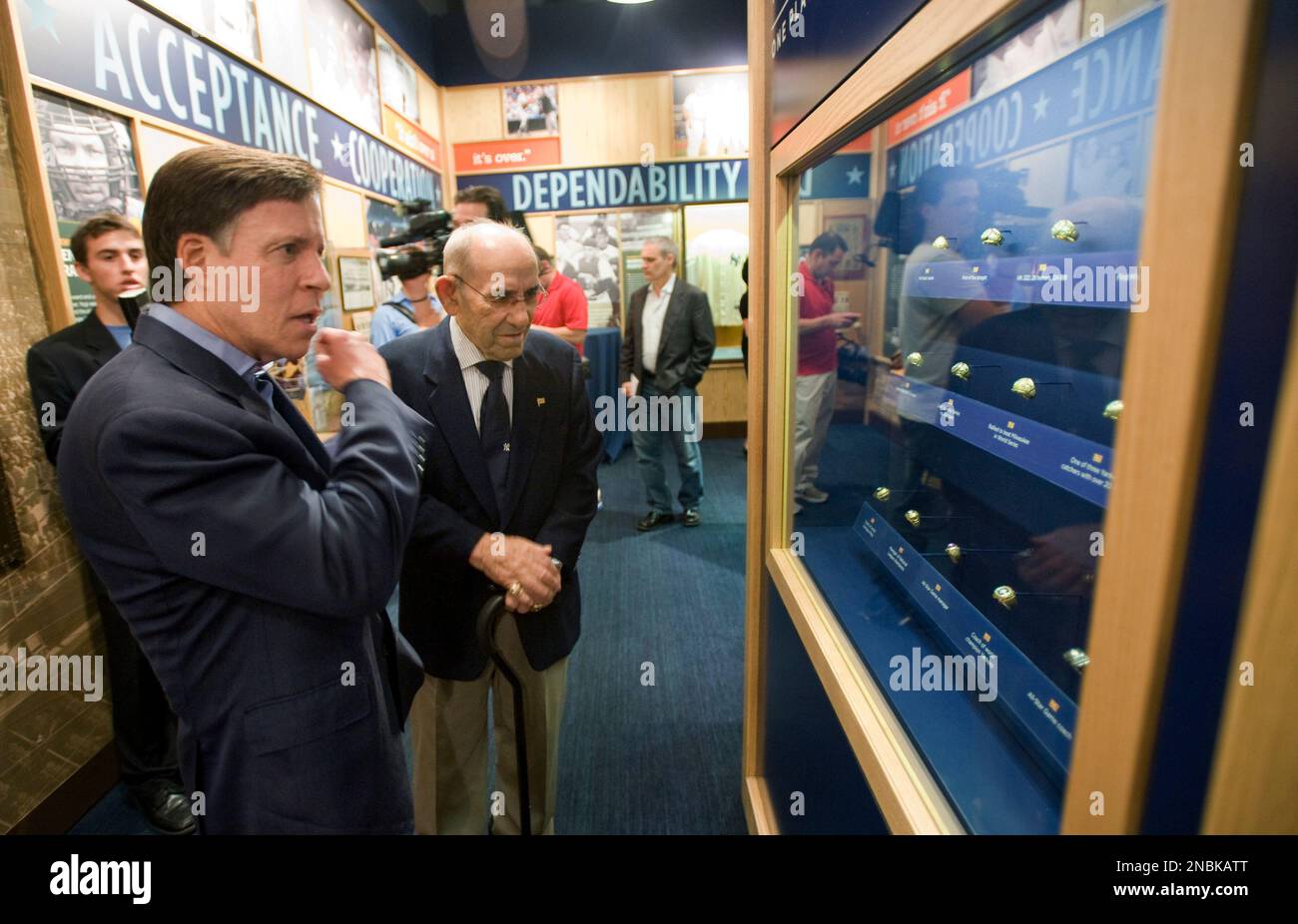 Bob Costas, left, talks with former New York Yankees' Yogi Berra as ...