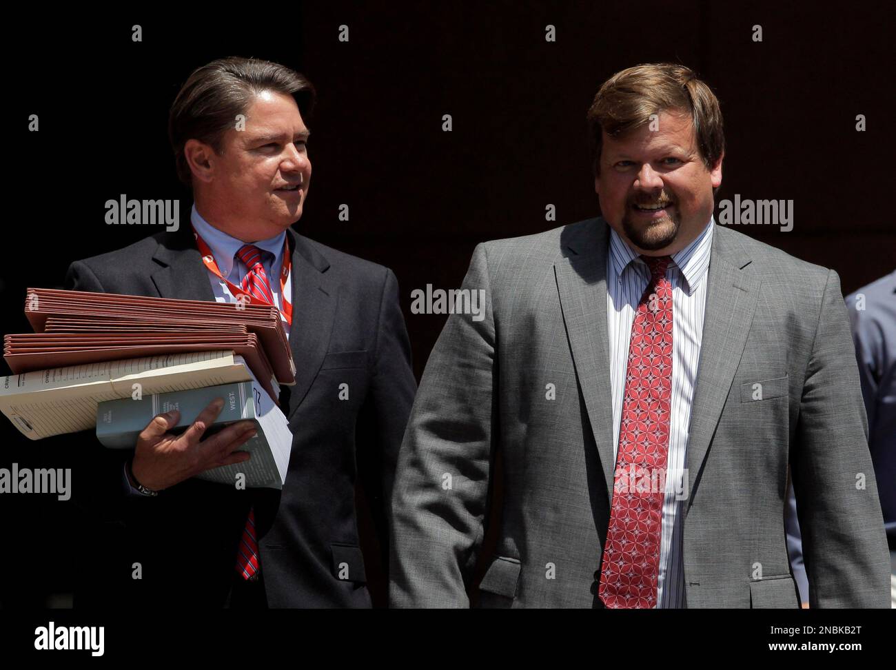 Thom Mrozek, left, spokesman for the U.S. attorney's office, talks to ...