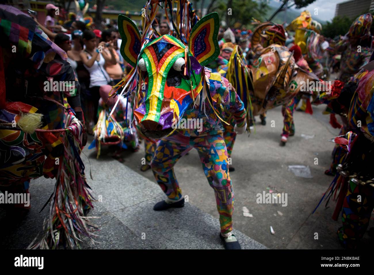 A man dressed as a devil, dances during the celebrations of the ...