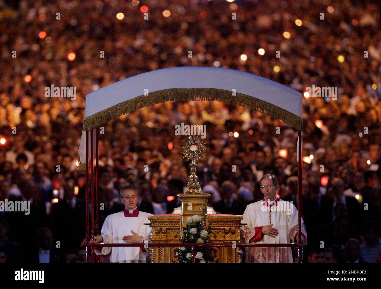 Pope Benedict XVI behing the Corpus Christ's relic, leads the Corpus ...