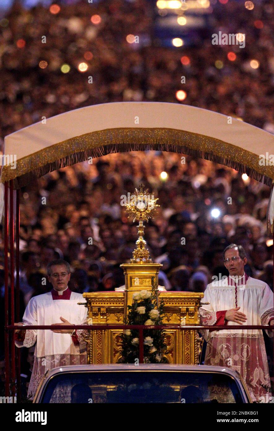Pope Benedict XVI behing the Corpus Christ's relic, leads the Corpus ...