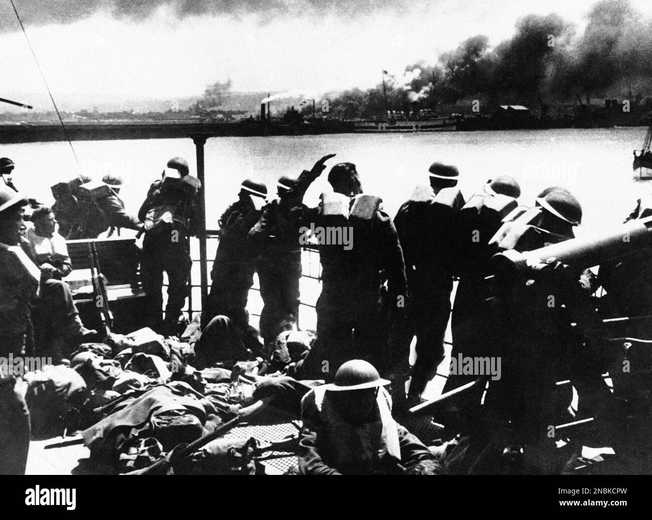 British Soldiers of the BEF take a final look back at the French coast ...