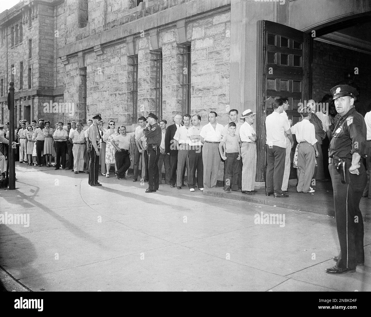 Before the huge drill shed of the State Armory, which was converted ...