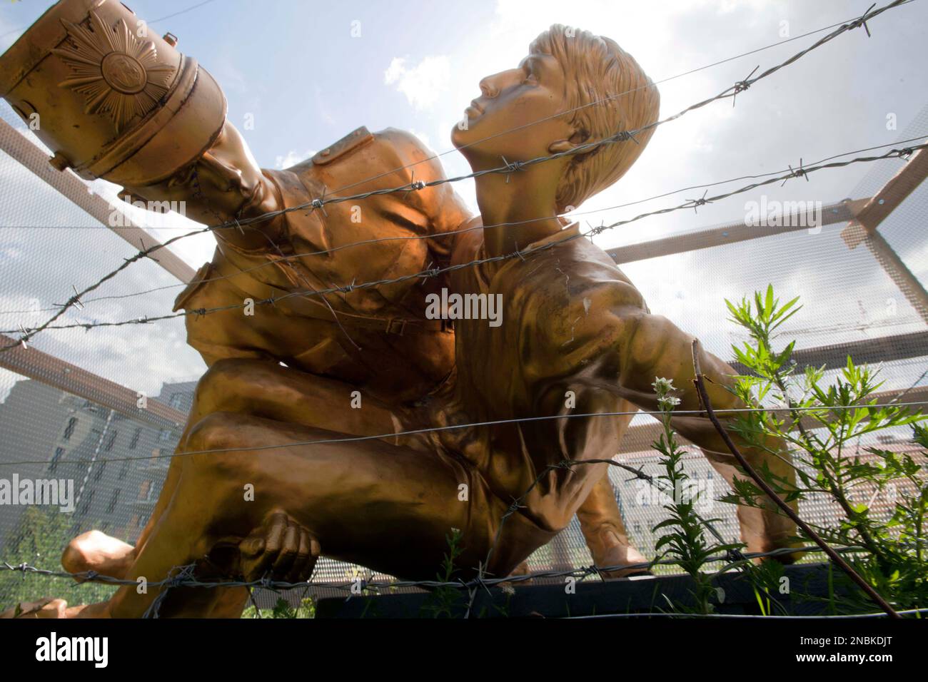 The destroyed statue that shows dying Peter Fechter being carried away ...