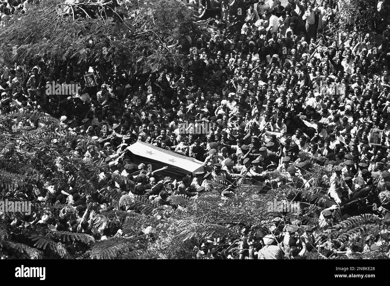 Drawn on a gun carriage the flag-covered coffin of President Abdel ...