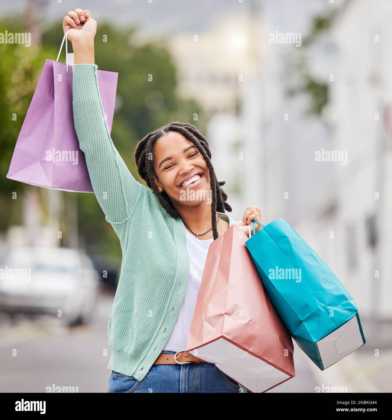 Fashion, portrait or black woman with success, shopping bag or smile ...