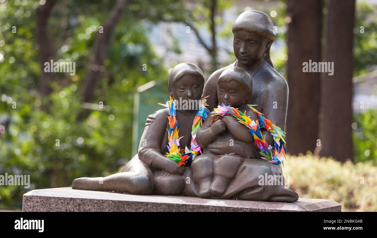 A statue of people taken in Japan Stock Photo - Alamy