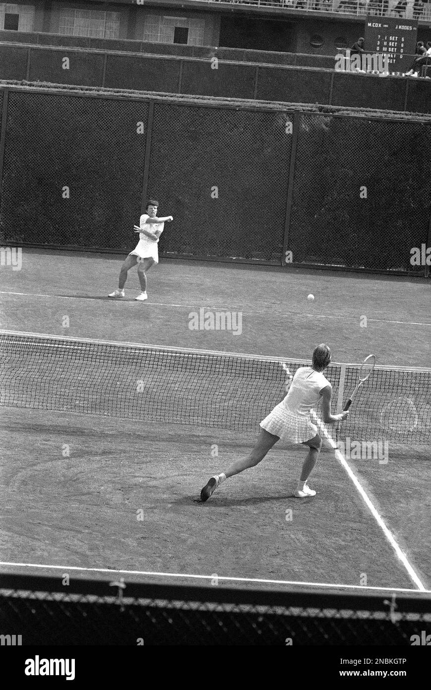 Action shot from the match between Billie Jean King (in background), of ...