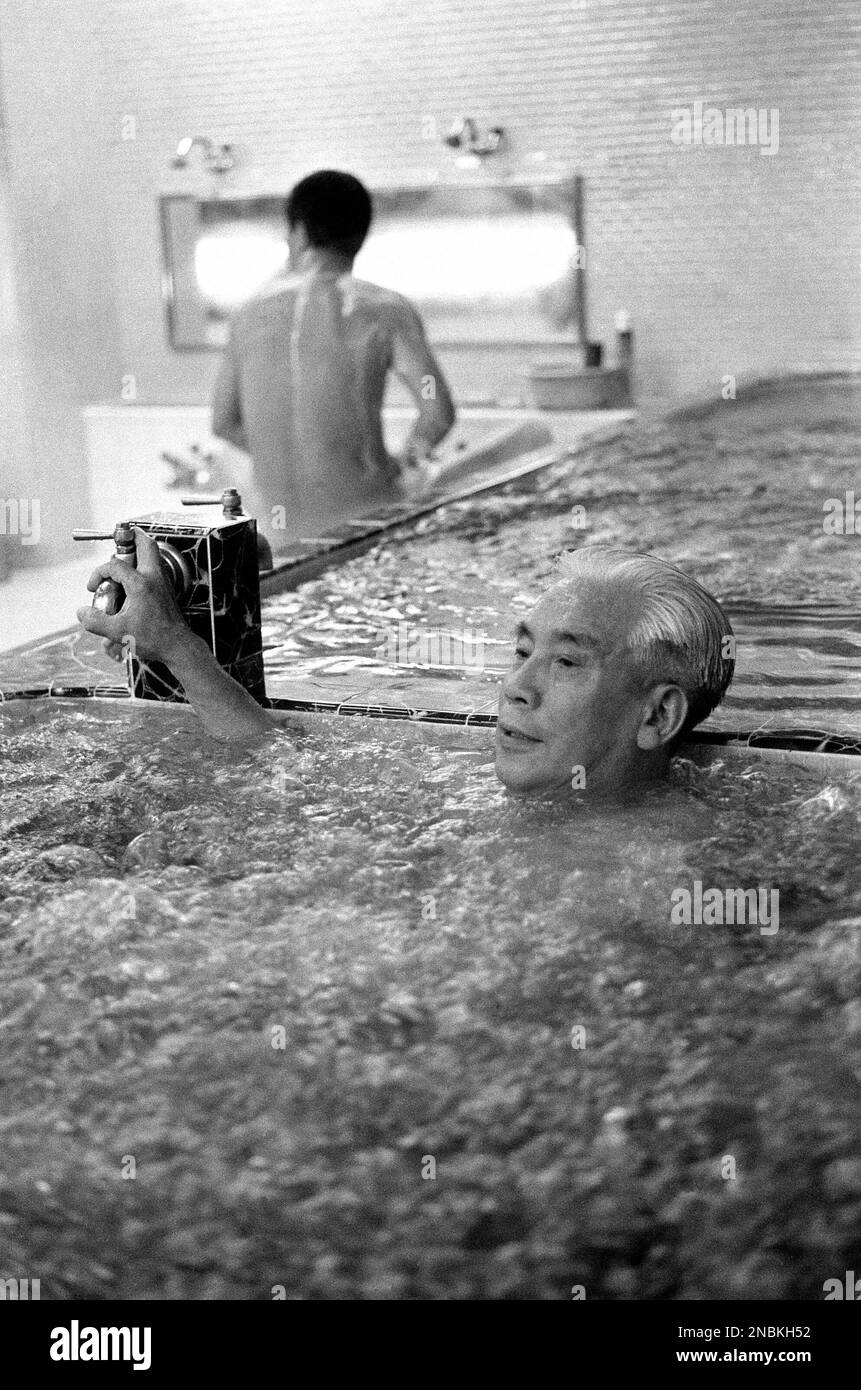 An older Japanese soaks away the cares of the day in the 108 degree F ...